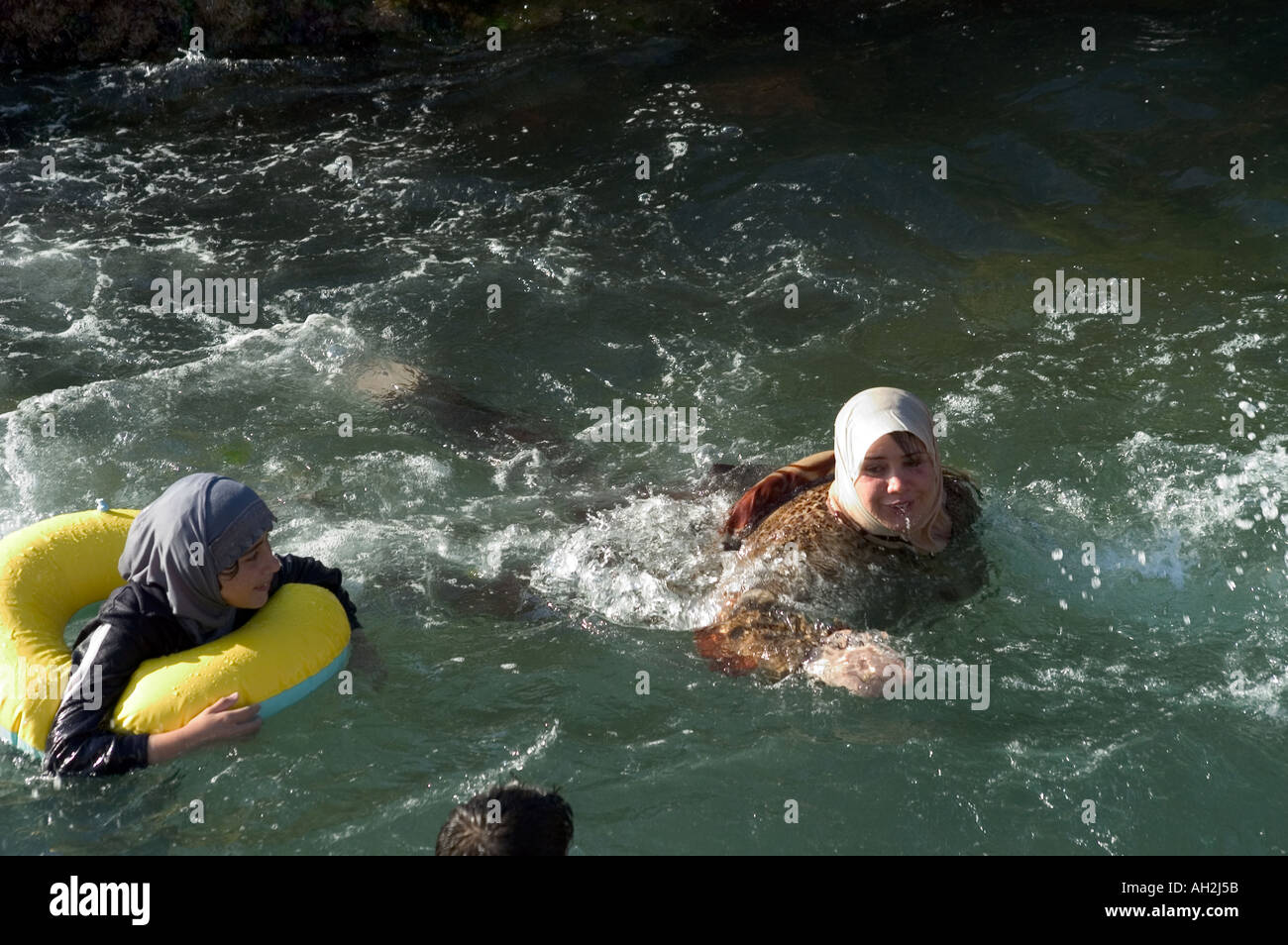 Muslim woman swimming hi-res stock photography and images - Alamy