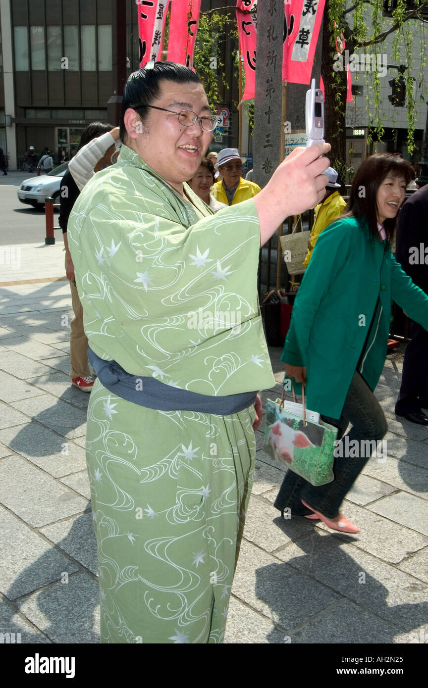 off duty sumo wrestler taking pictures with mobile phone Tokyo City ...