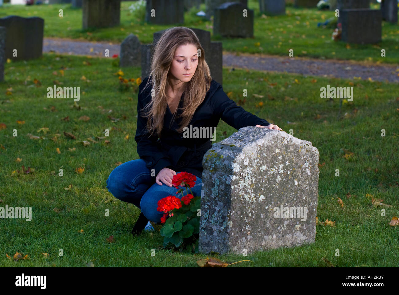 Someone Mourning At A Grave