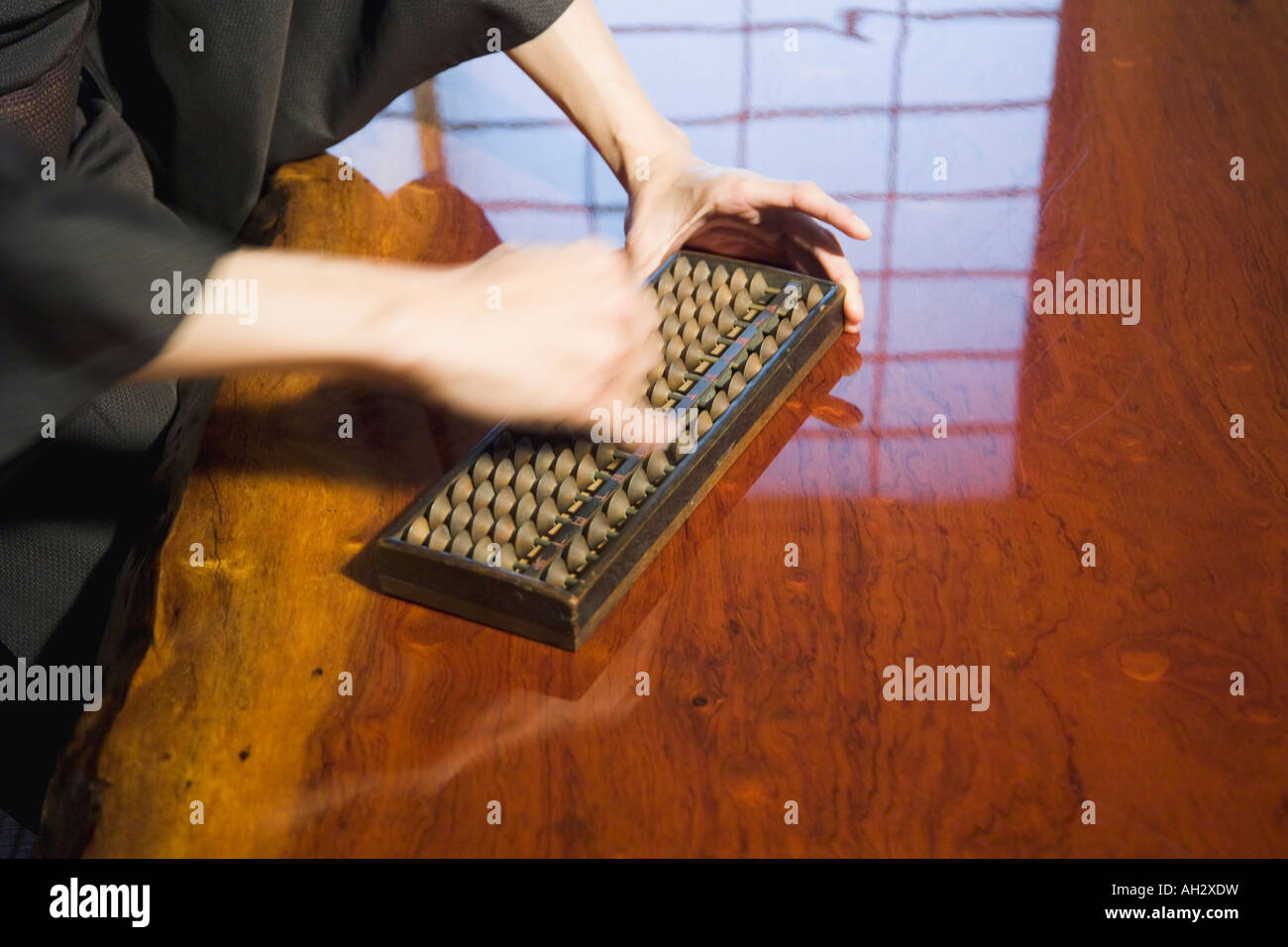 Man calculating with abacus Stock Photo - Alamy