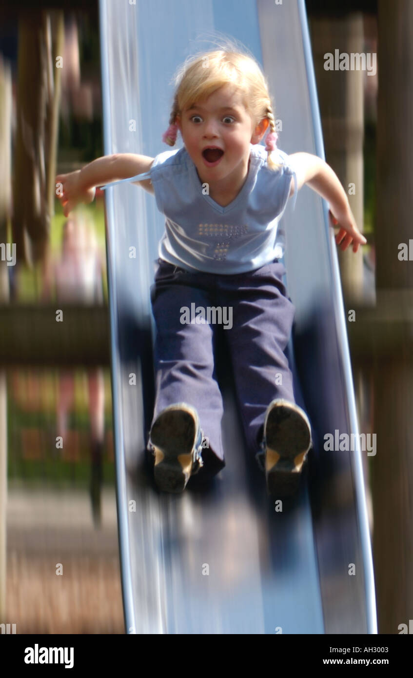 Child going down playground slide hi-res stock photography and images ...