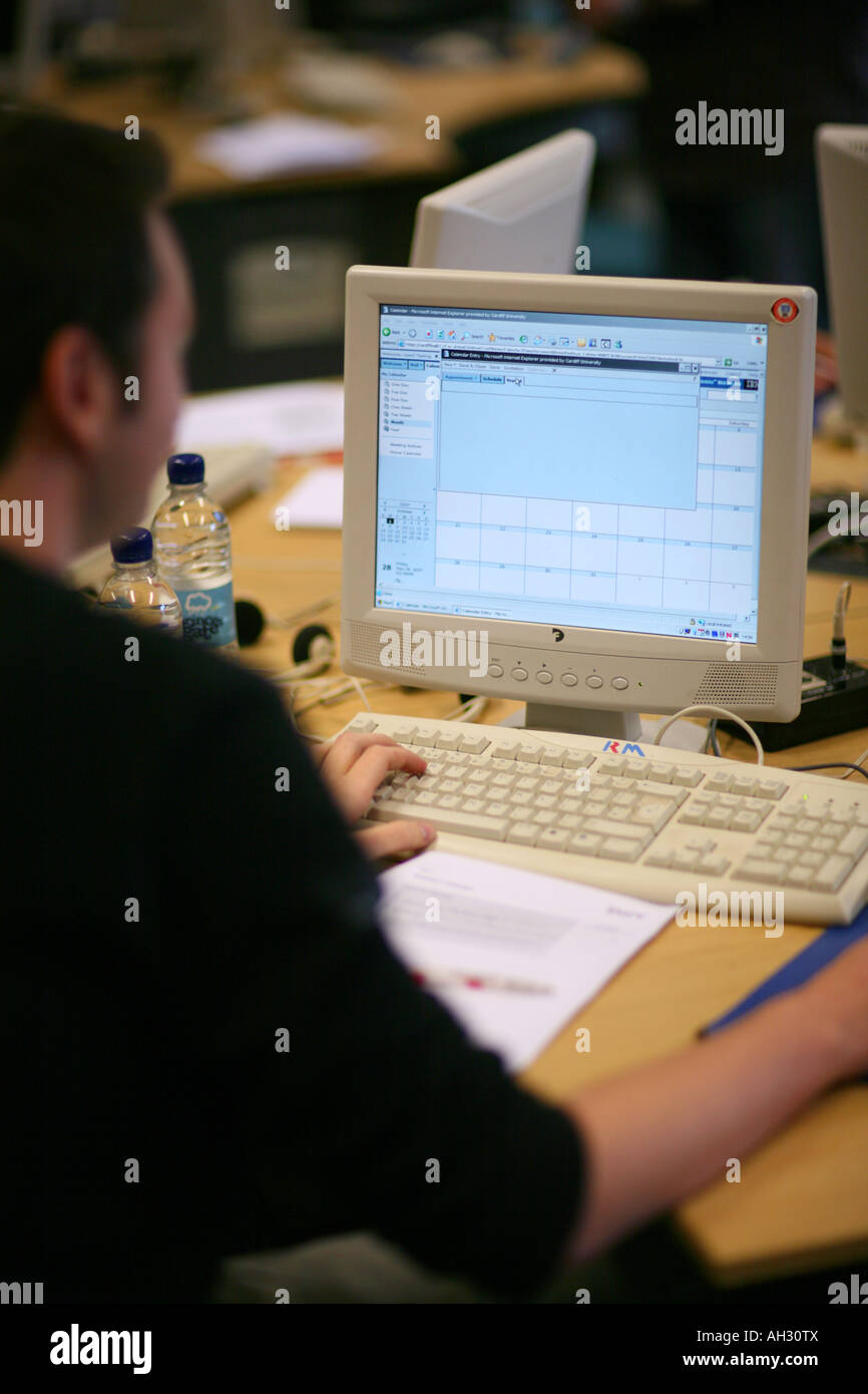 man works at computer Stock Photo - Alamy