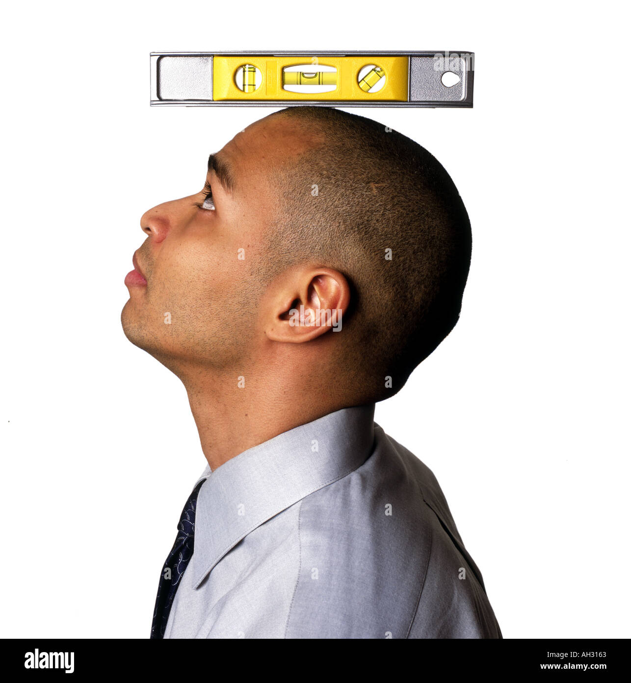 African American Man with level on head Stock Photo - Alamy