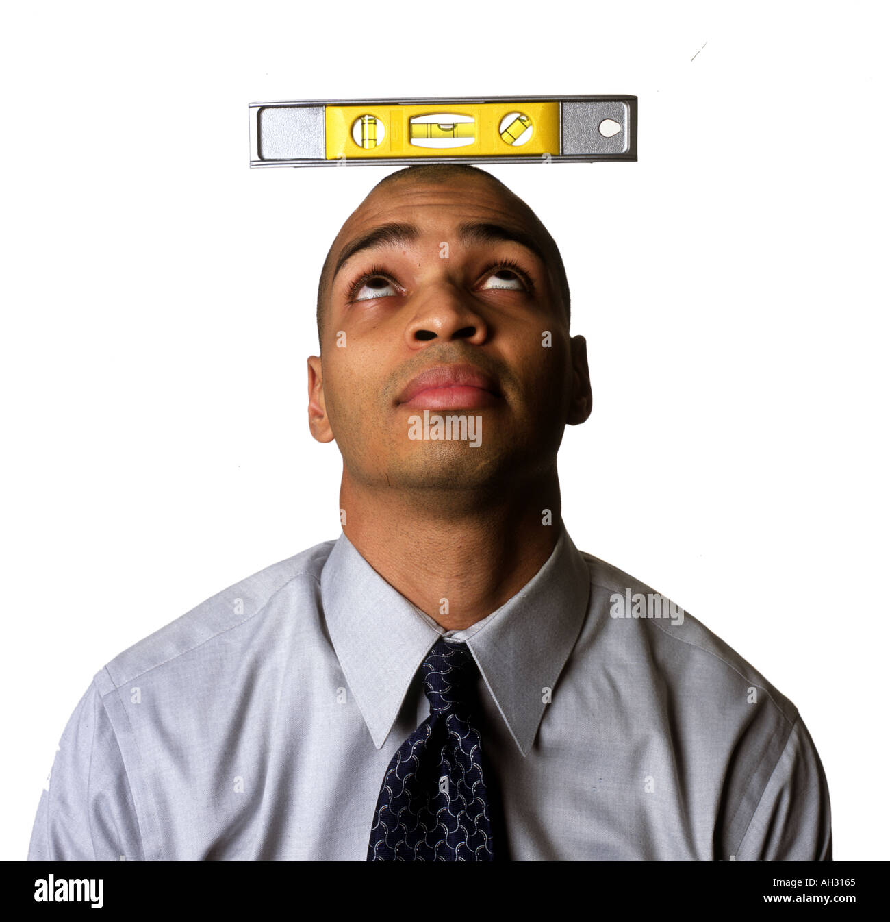 African American Man with level on head Stock Photo - Alamy