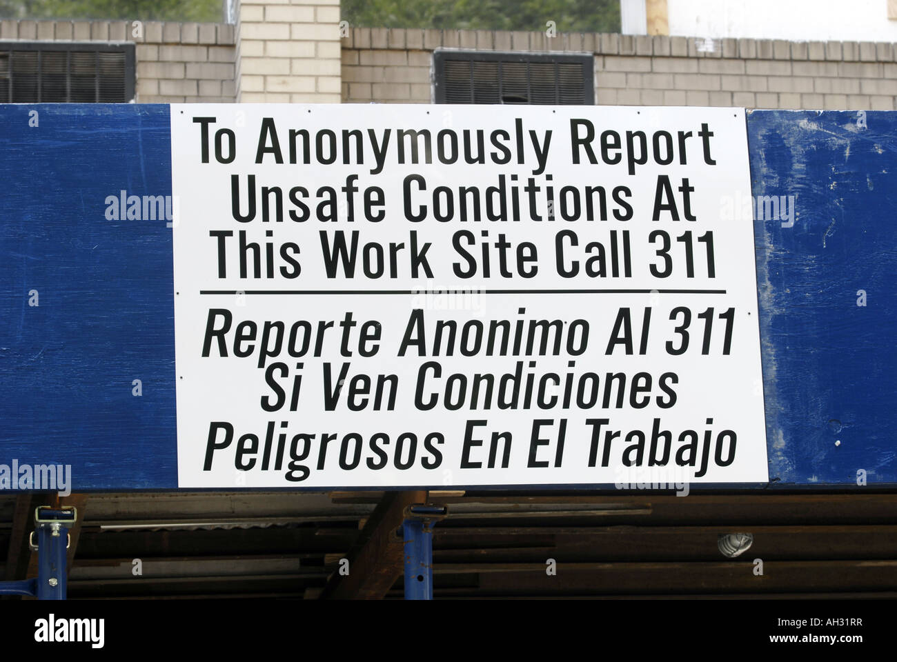 to anonymously report unsafe conditions at this work site call 311 sign ...