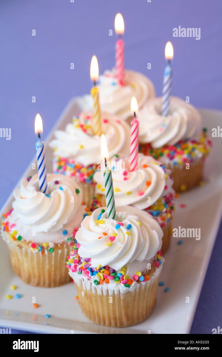 Birthday Cupcakes with Candles Stock Photo - Alamy