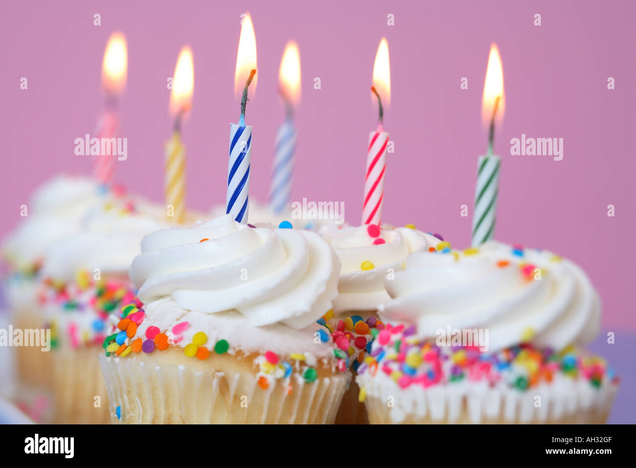 Birthday Cupcakes with Candles Stock Photo - Alamy