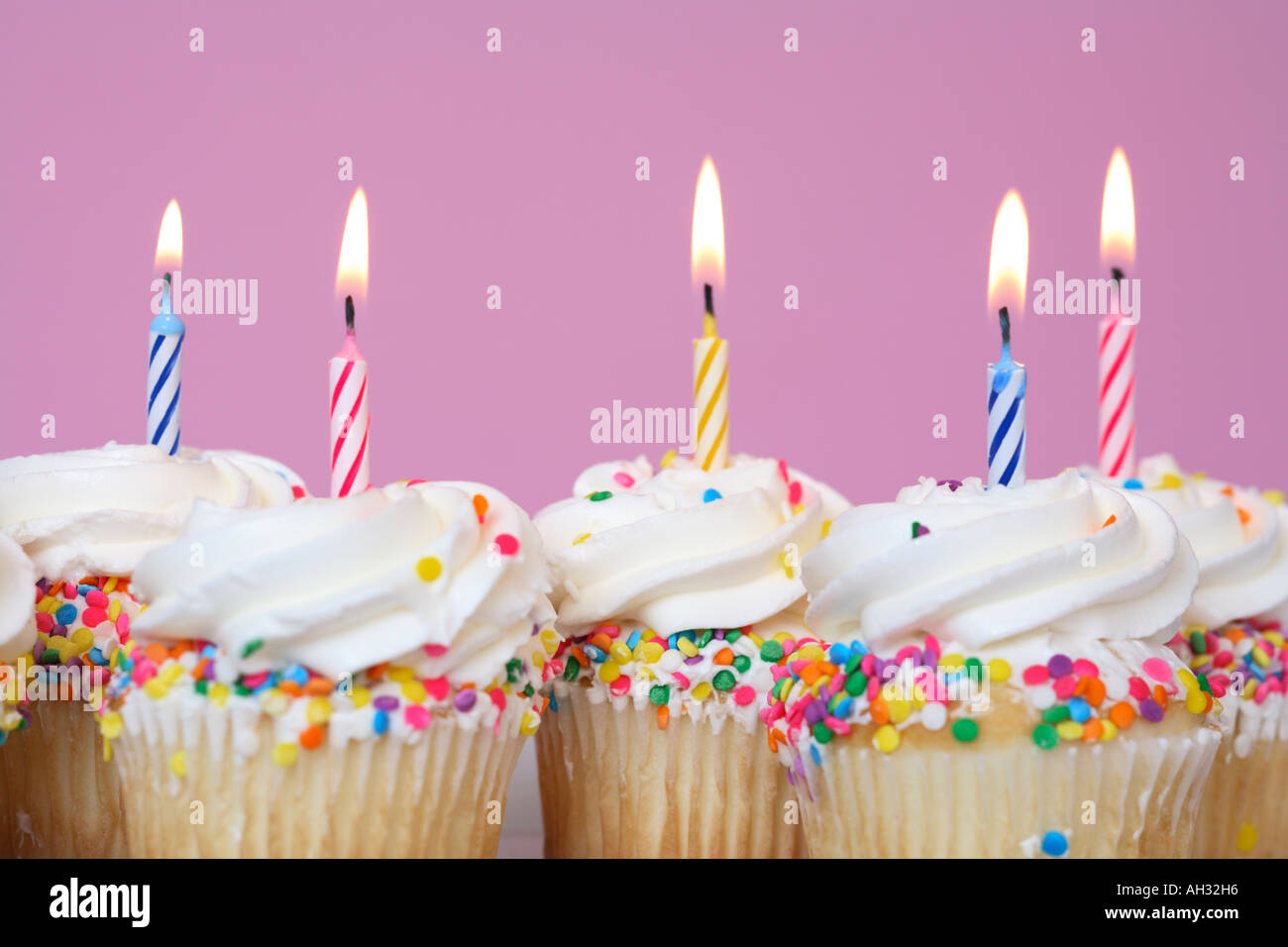 Birthday Cupcakes with Candles Stock Photo - Alamy
