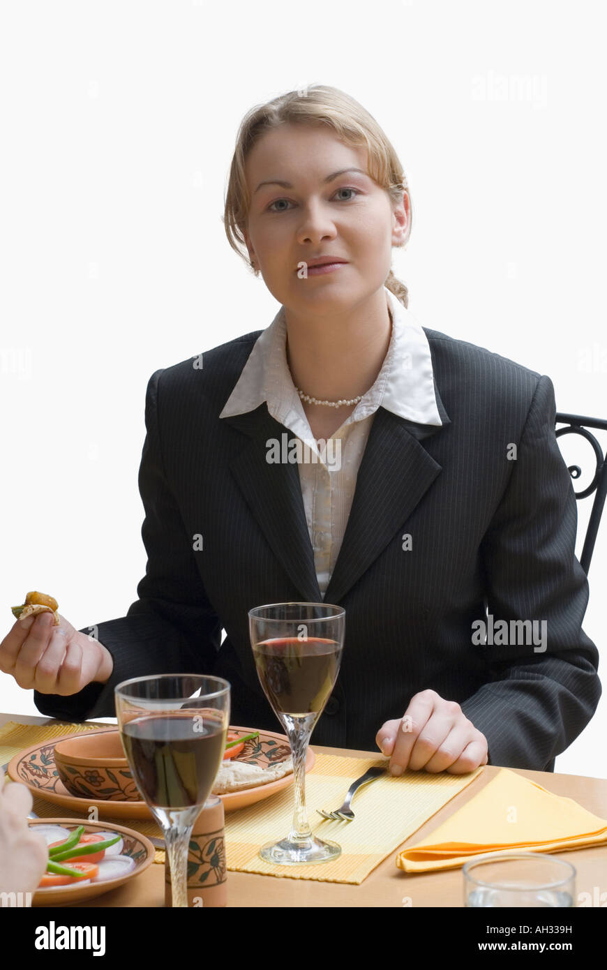 Portrait of a businesswoman at the dining table Stock Photo - Alamy