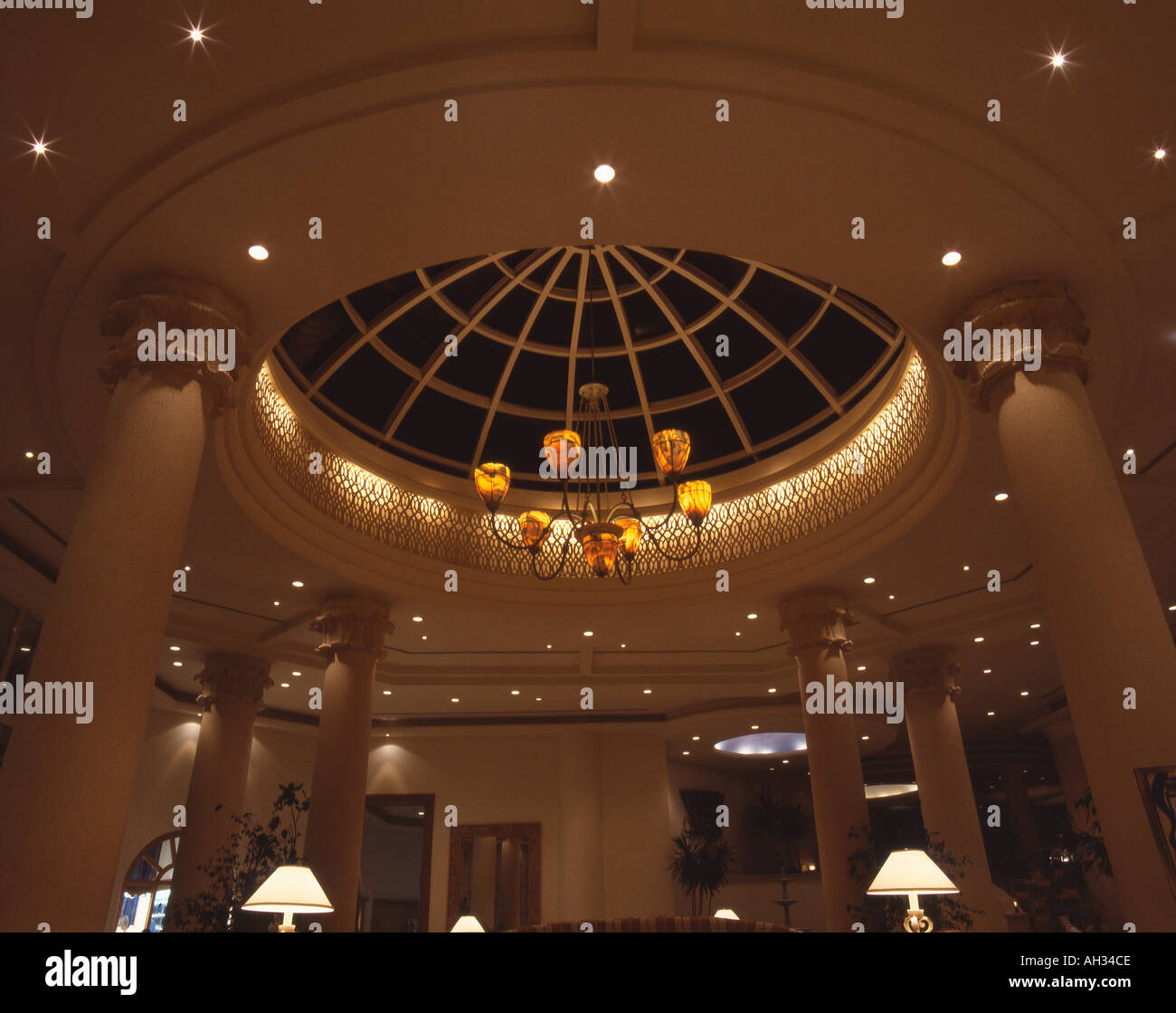 Mysterious round hall with columns, dome and orange chandelier Stock ...