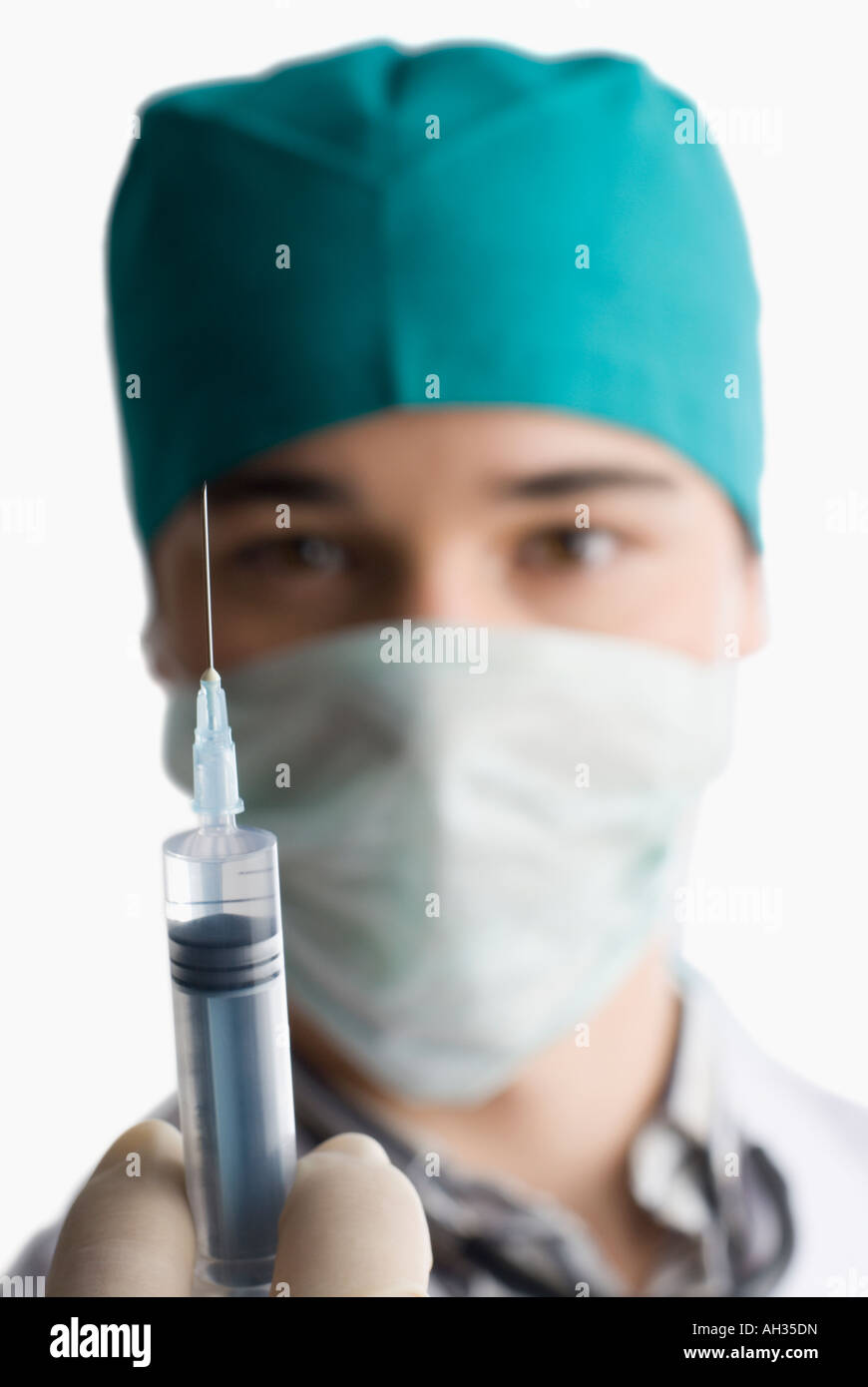 Portrait of a male doctor holding an injection Stock Photo - Alamy