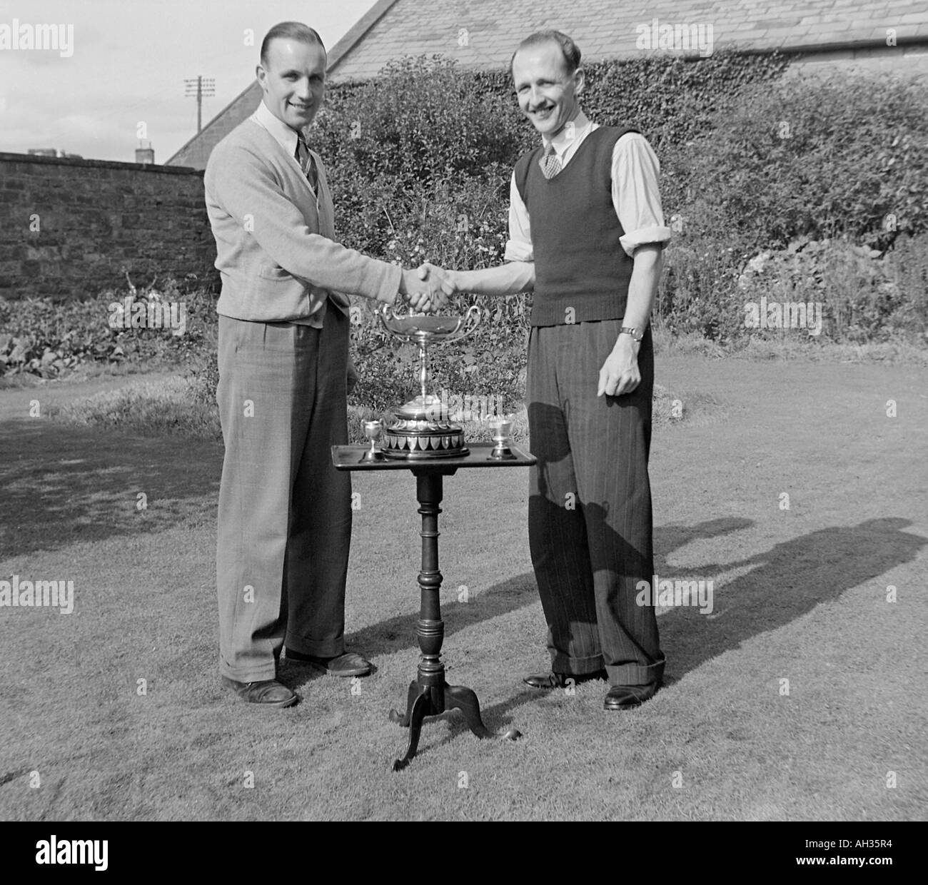 Two men table in Black and White Stock Photos & Images - Alamy