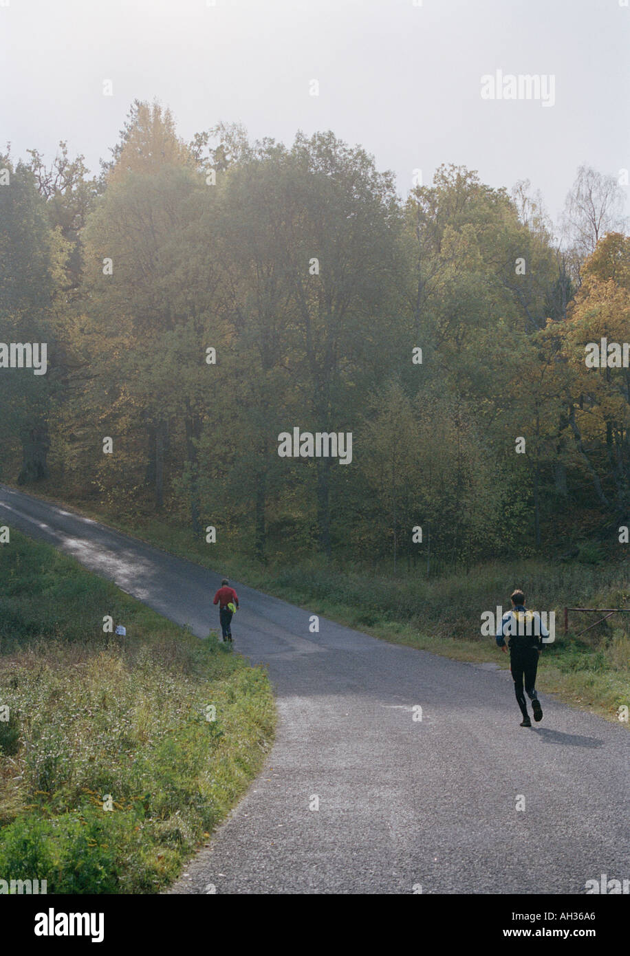 Lonely runner on road hi-res stock photography and images - Alamy
