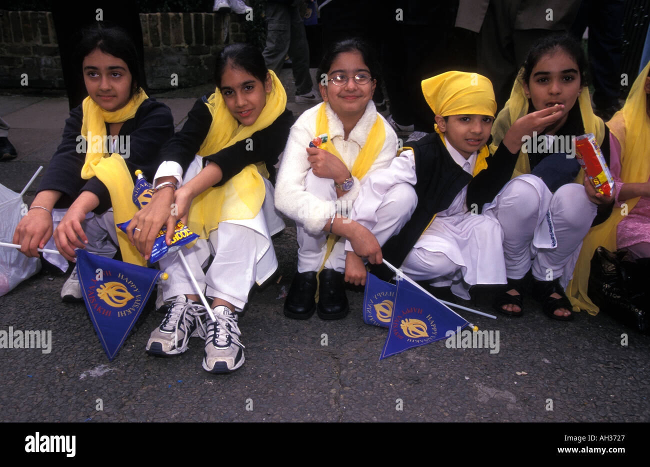 Group of young Sikh children sitting down during the festival of ...