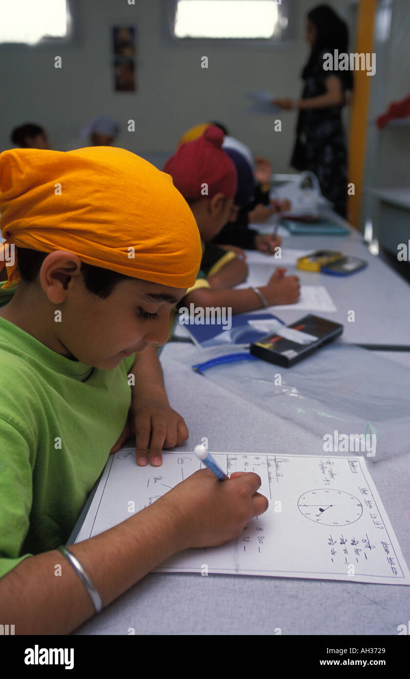 Young Sikh boy in classroom learning Punjabi London UK Stock Photo - Alamy