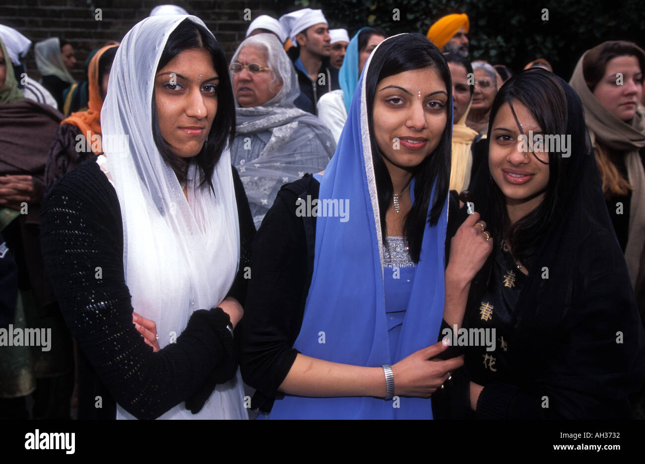 Three young Sikh women during the festival of Vaisakhi, Southall ...