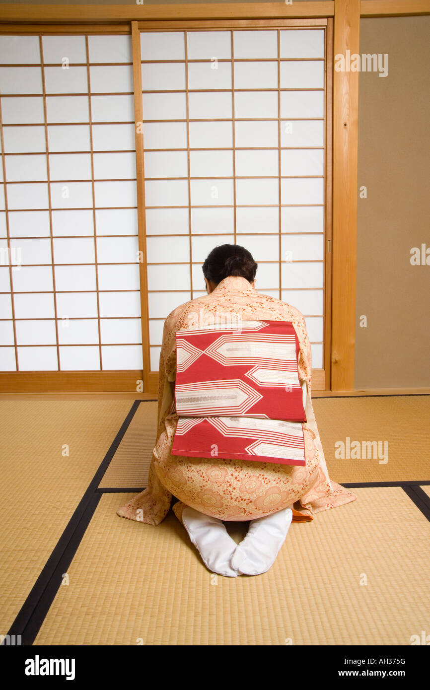 Woman bowing, rear View Stock Photo - Alamy