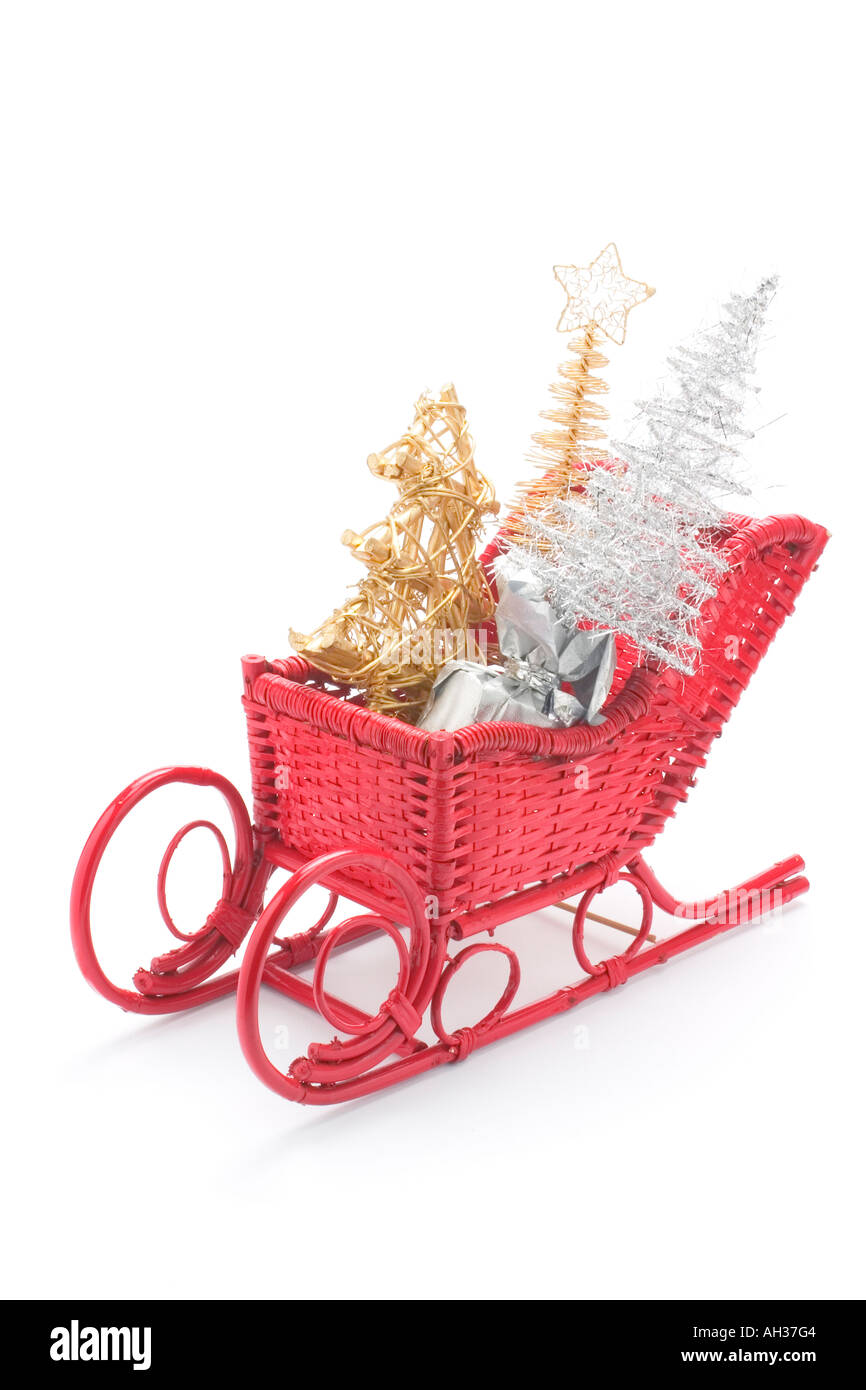 Christmas Trees on Miniature Sleigh Stock Photo - Alamy