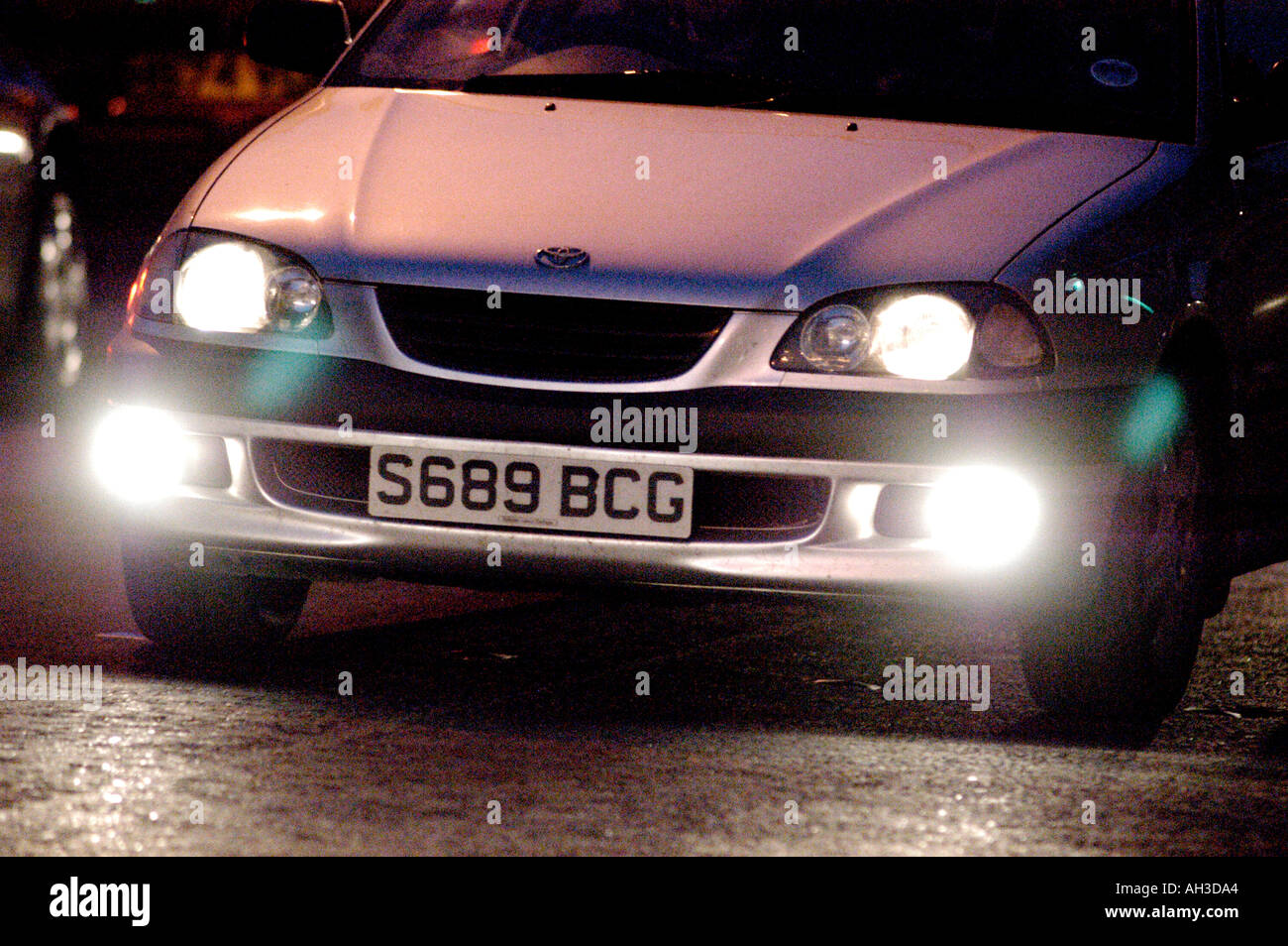Car with its fog lights on Stock Photo - Alamy