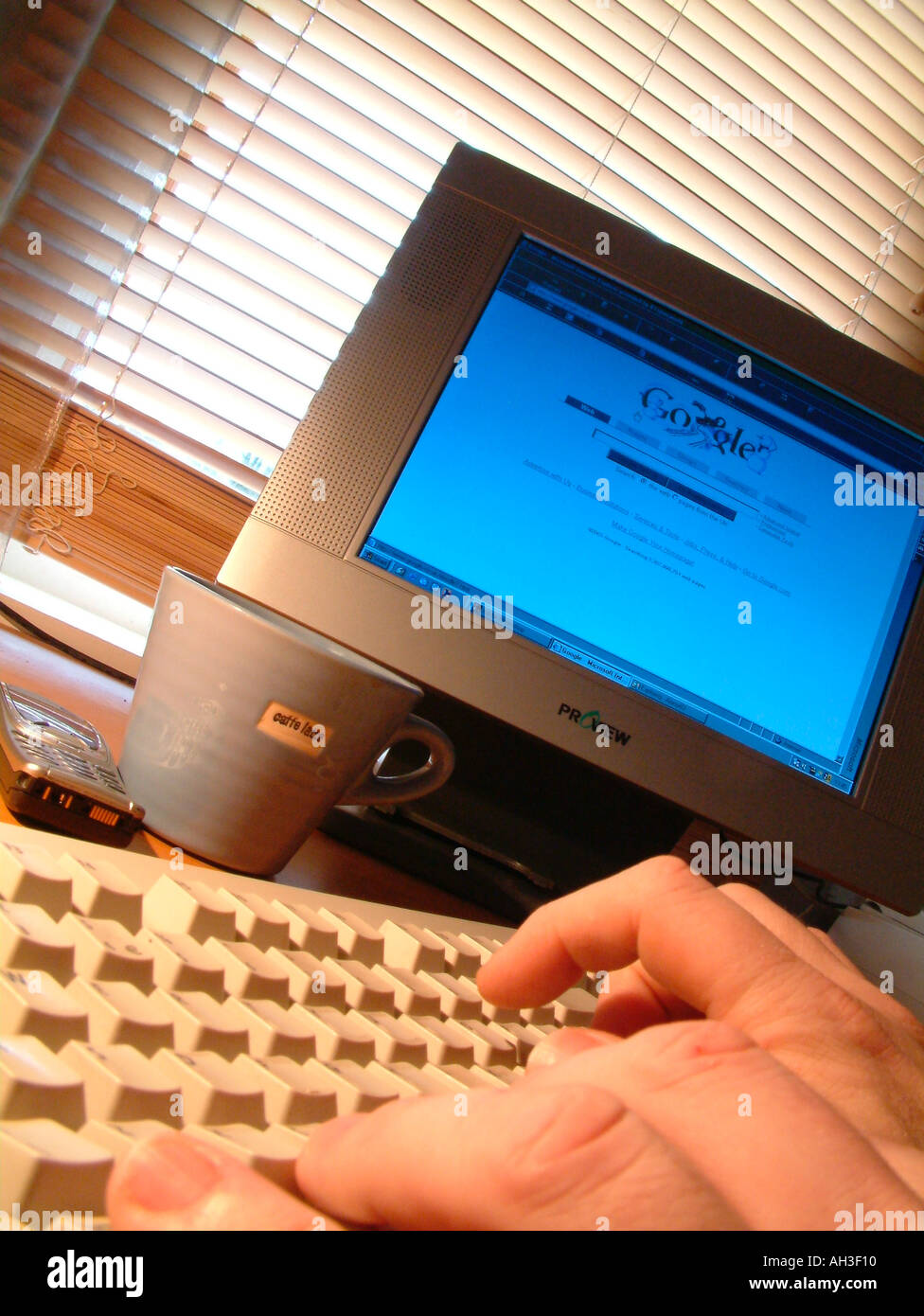 Man typing at computer keyboard with screen in background Stock Photo ...