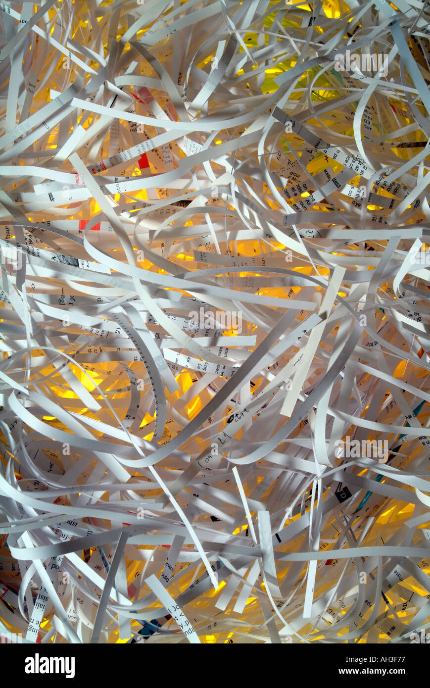 Shredded paper yellow background Stock Photo - Alamy