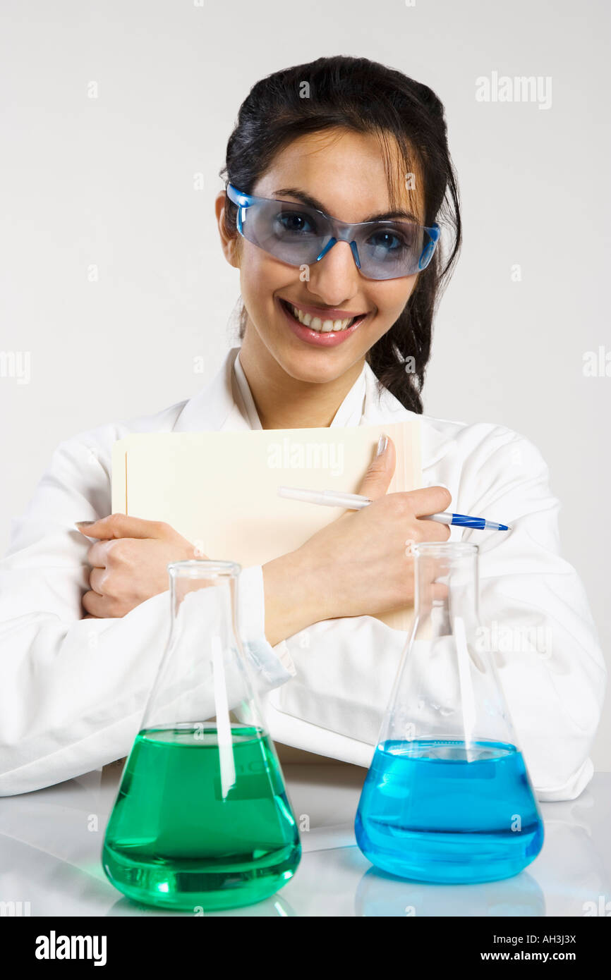 Woman in lab coat smiling Stock Photo - Alamy