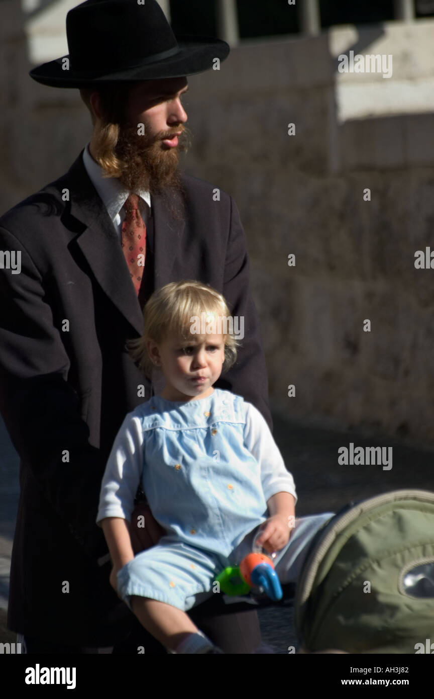Jewish man in traditional clothes with child Old Walled City Jerusalem ...