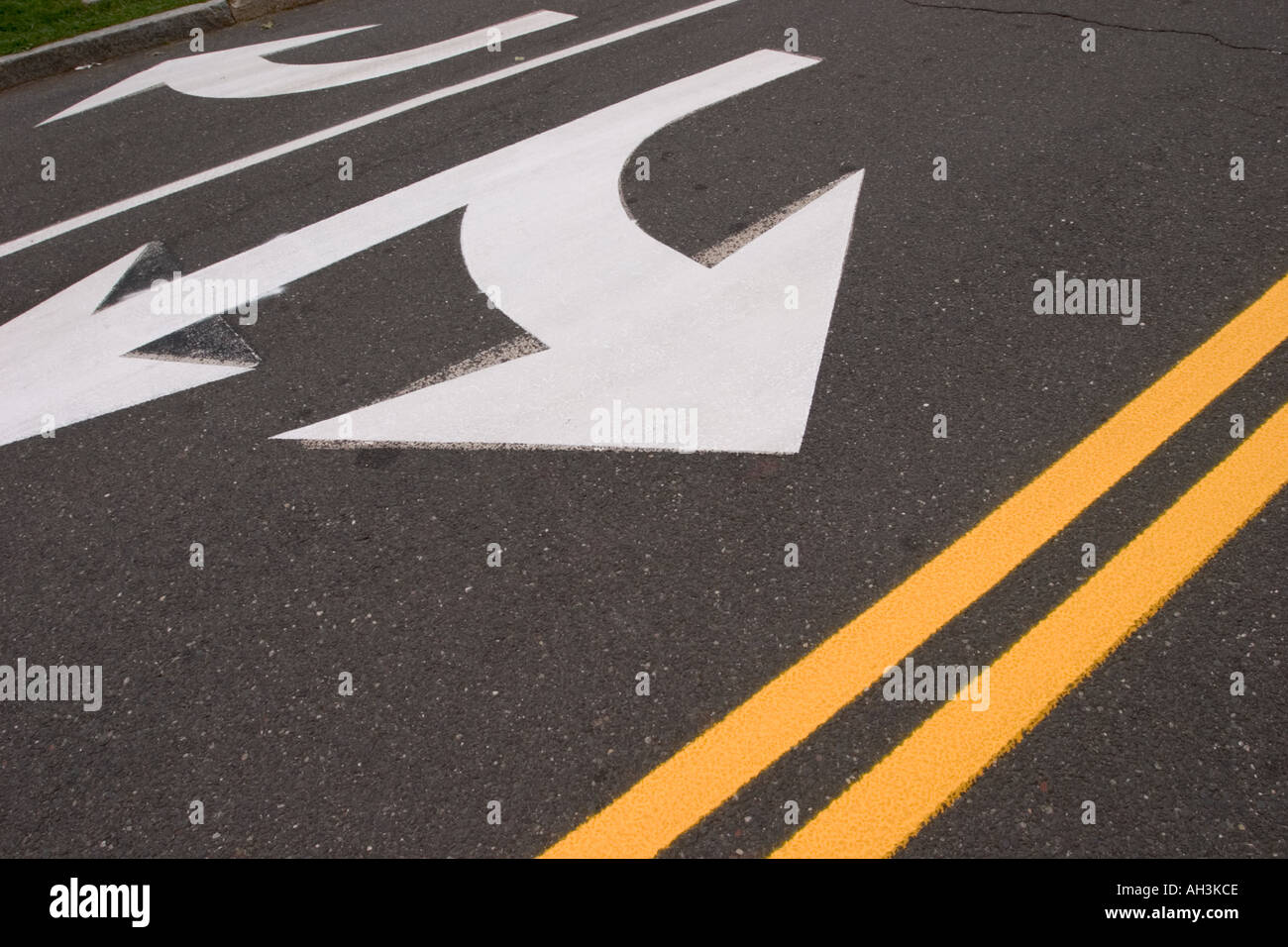 Directional arrows on a city street Stock Photo - Alamy