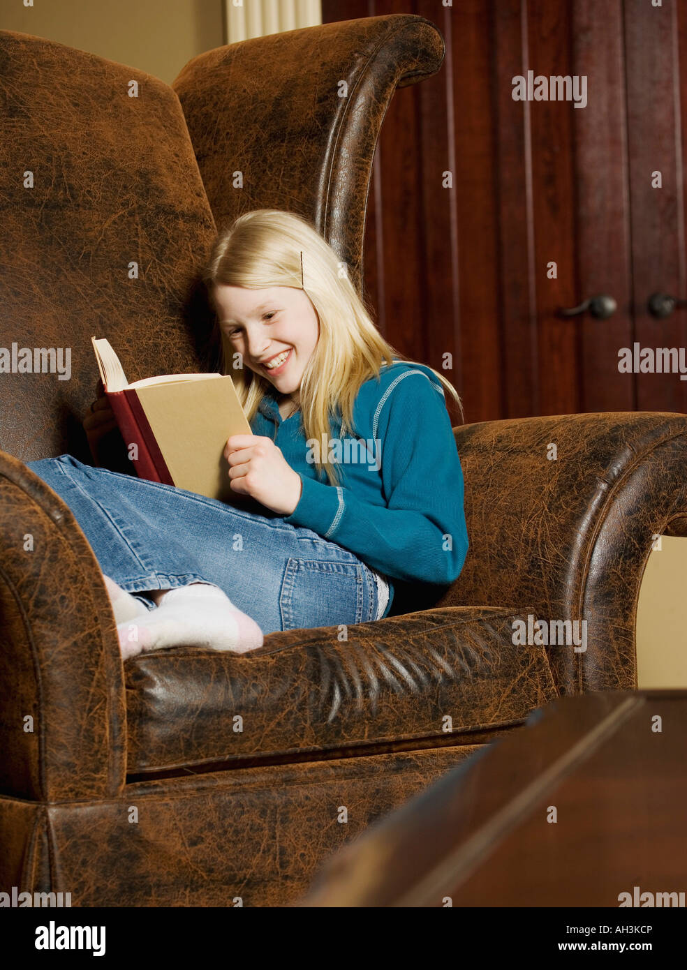 Girl reading a book Stock Photo - Alamy