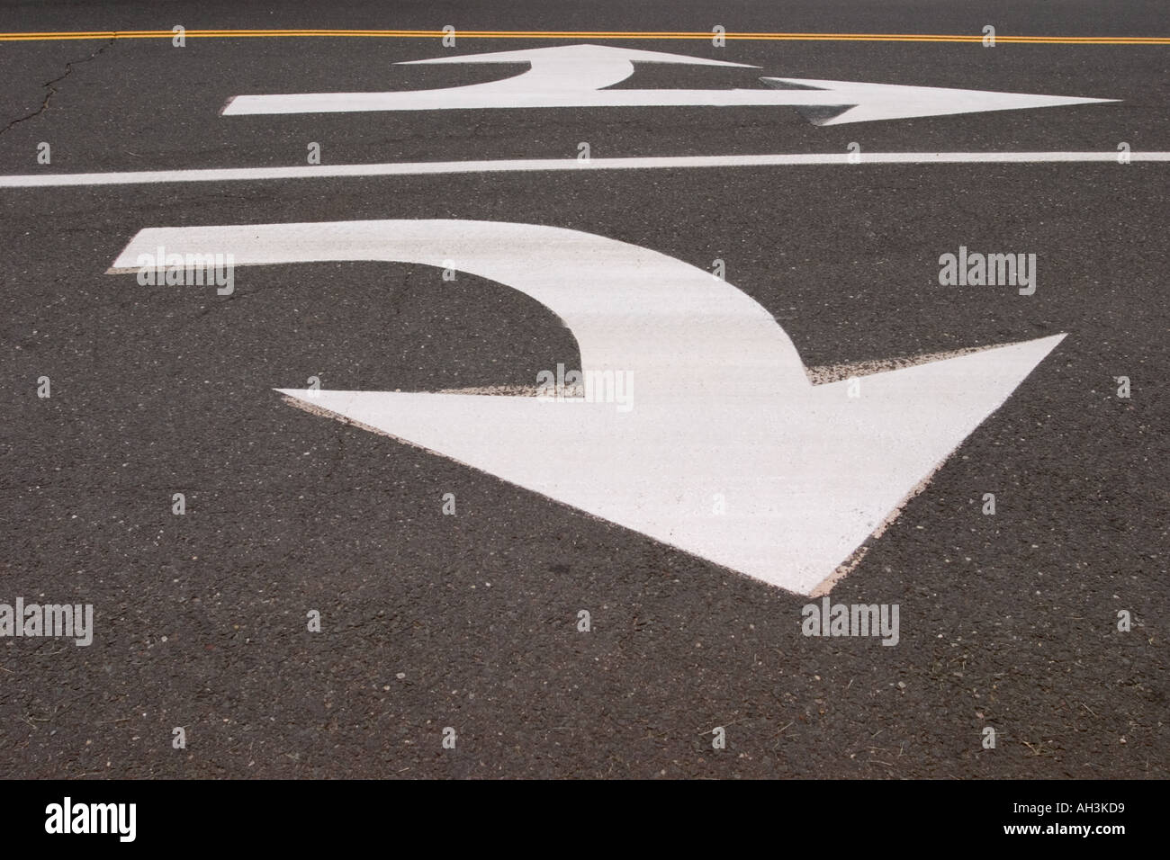 Directional arrows on a city street Stock Photo - Alamy
