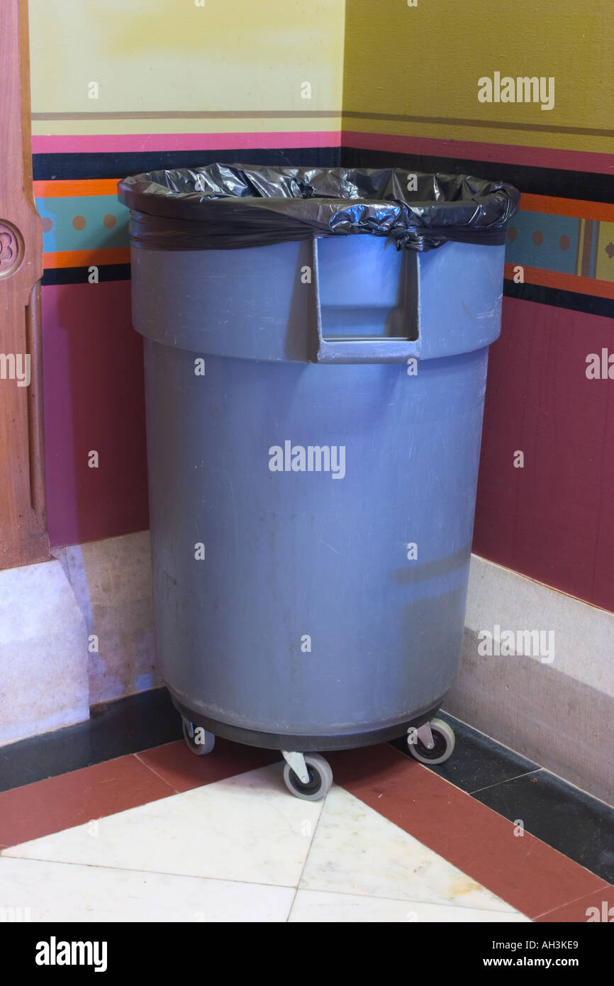 Trash barrel setting in the corner of an office hallway Stock Photo - Alamy