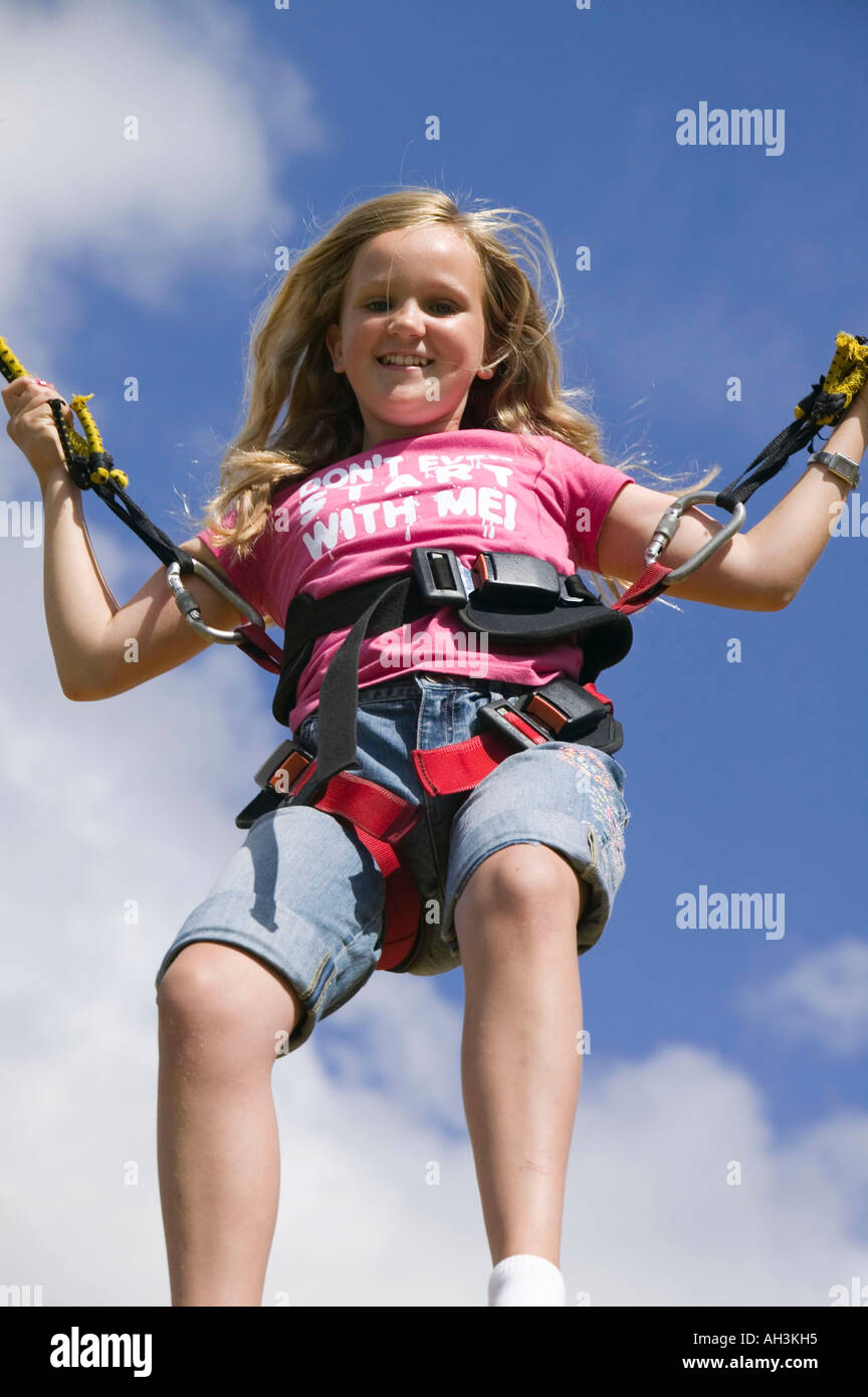 child on a bungee machine at Ambleside sports, Lake district, UK Stock ...