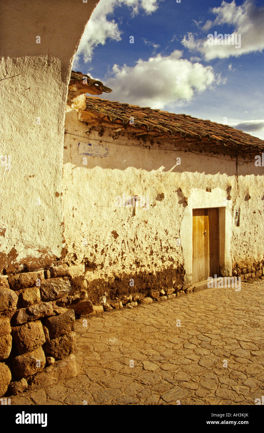 A scenic arch and traditional adobe houses in Chinchero, Urubamba ...