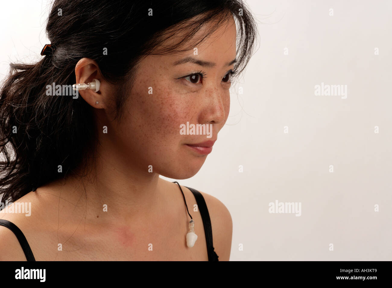 Young asian woman wearing an tree style ear defender Stock Photo - Alamy