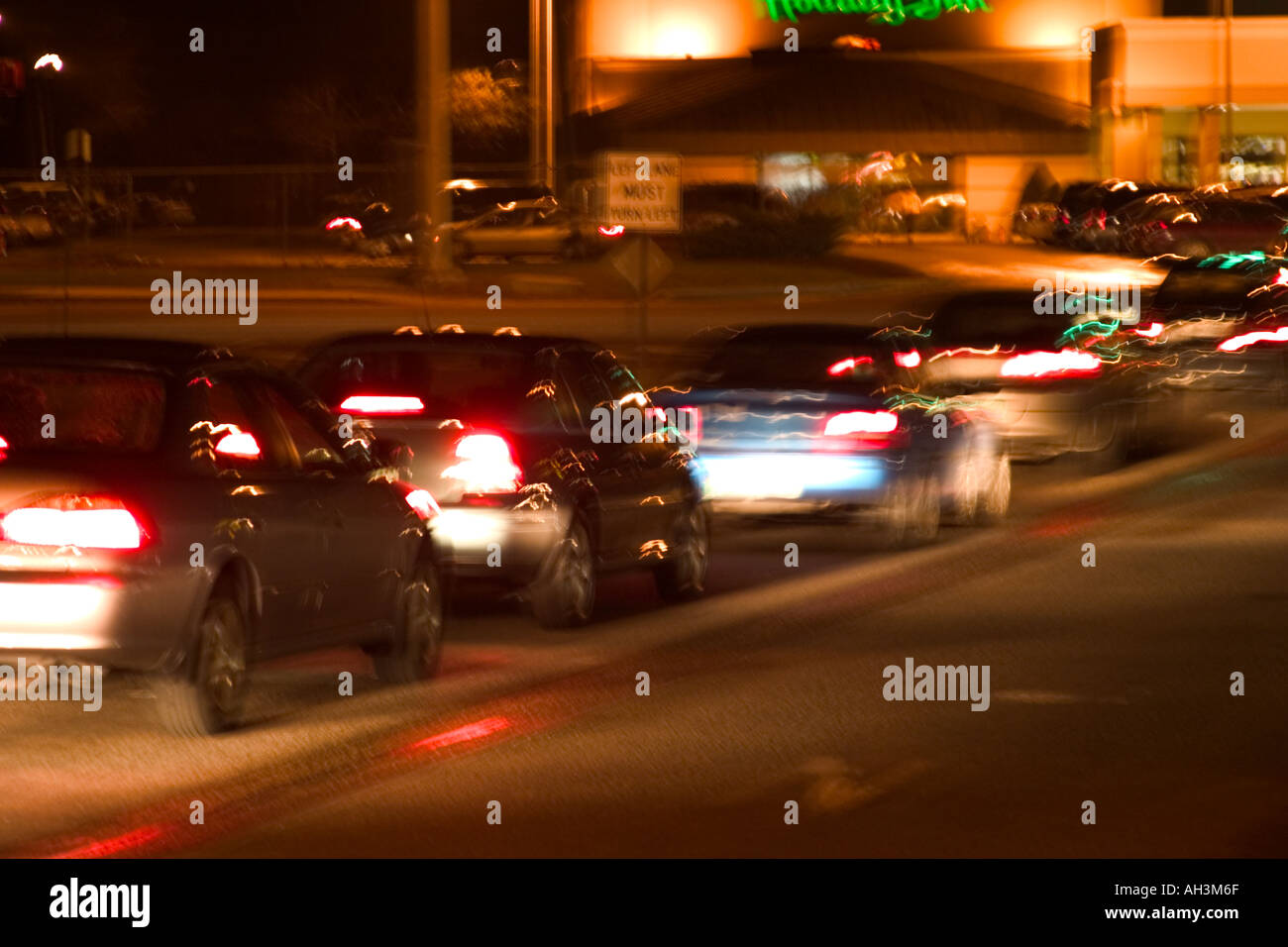 Automobiles at night stopped at a traffic light Stock Photo - Alamy