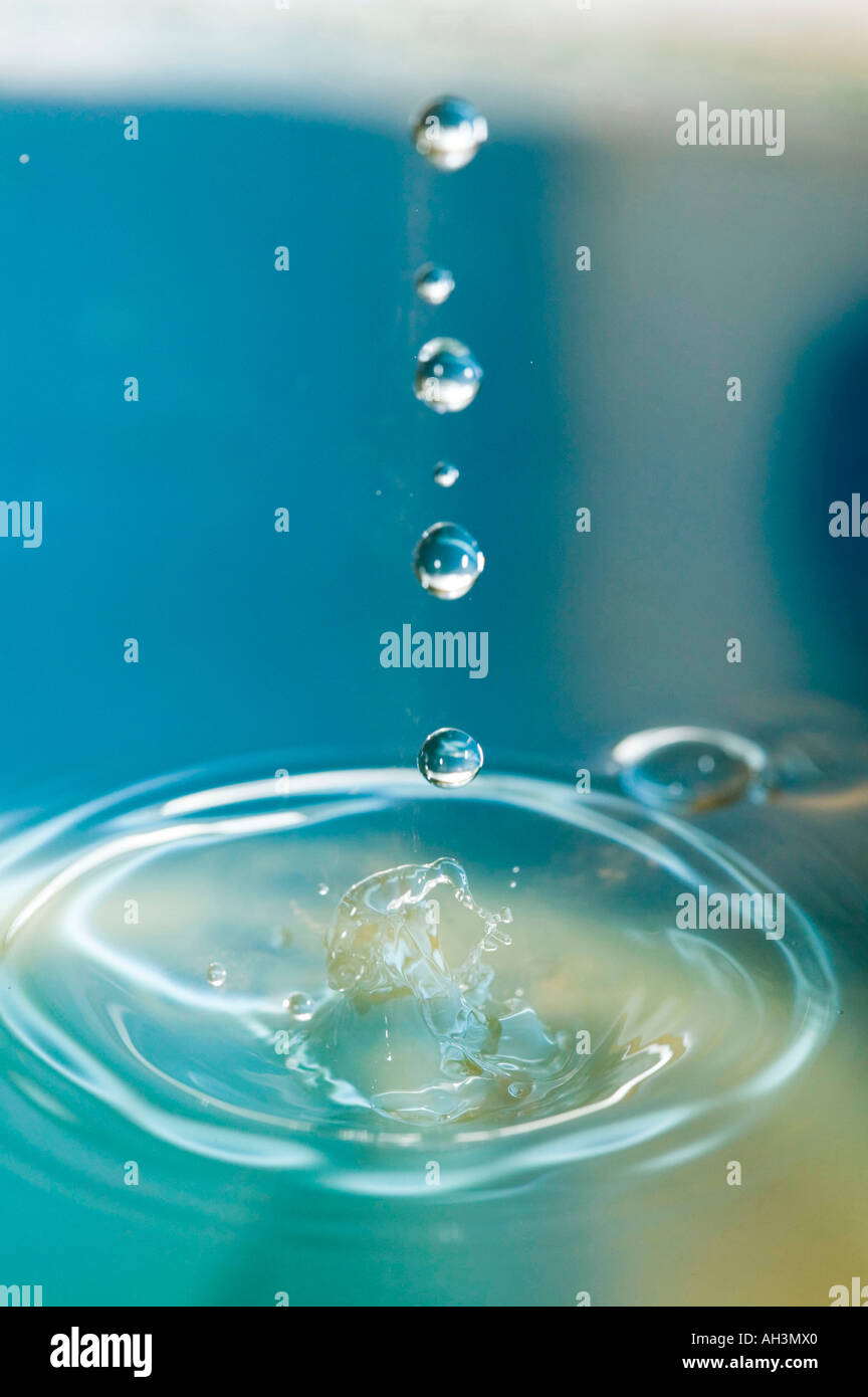 a water droplet hitting a water surface Stock Photo - Alamy