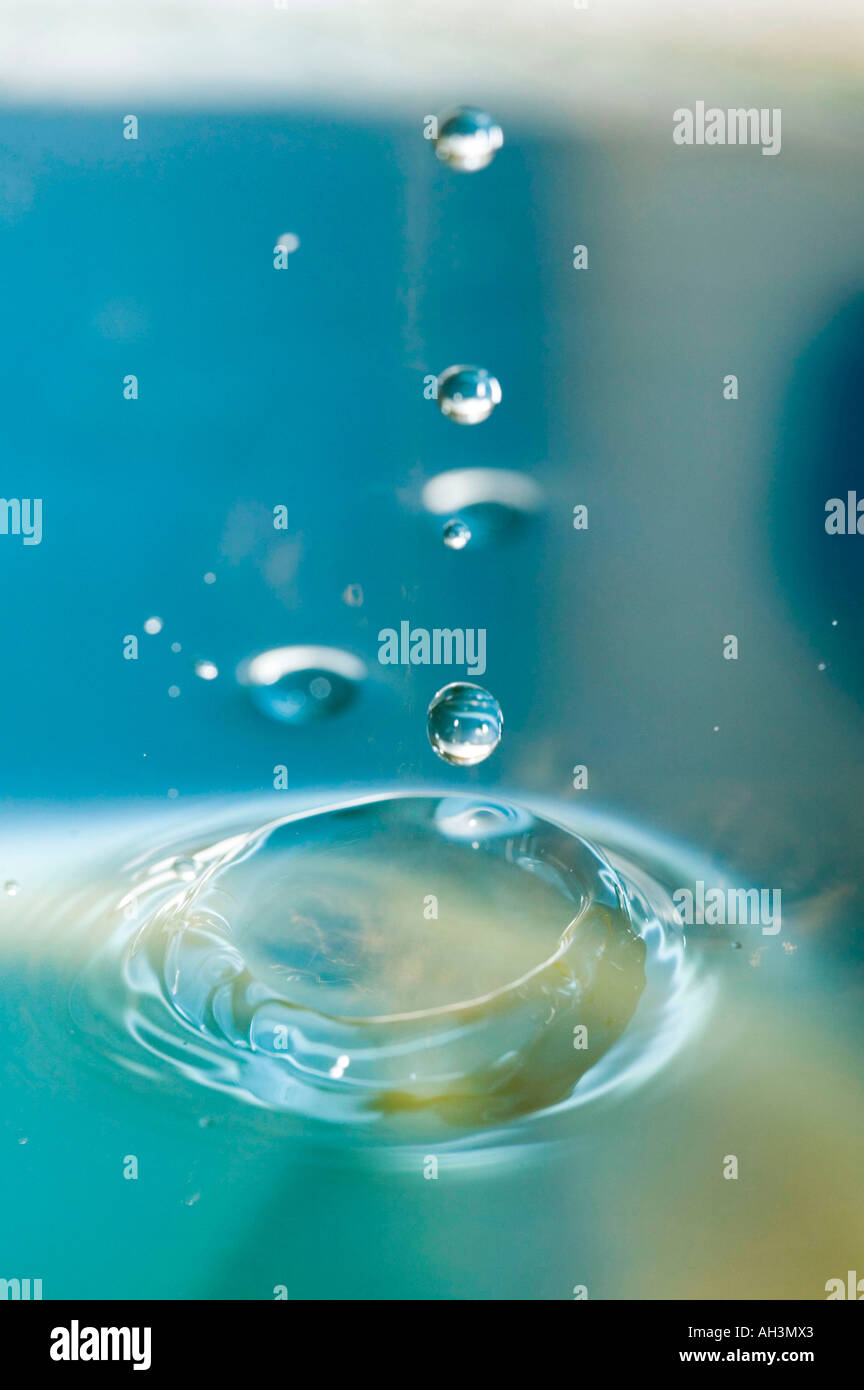 a water droplet hitting a water surface Stock Photo - Alamy