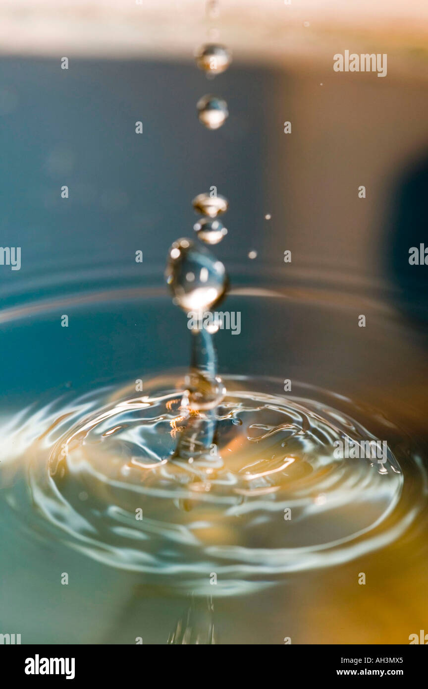 a water droplet hitting a water surface Stock Photo - Alamy