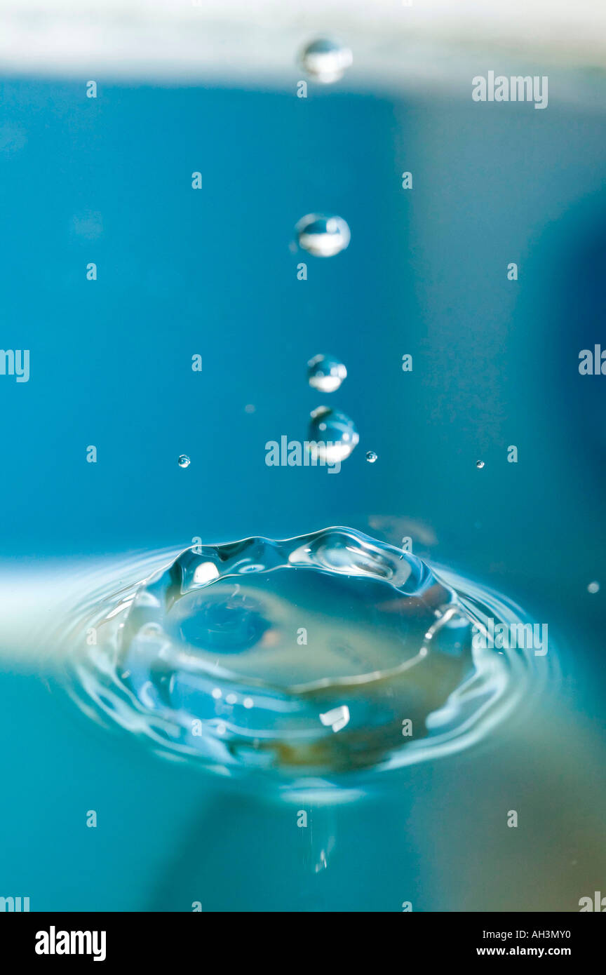 a water droplet hitting a water surface Stock Photo - Alamy