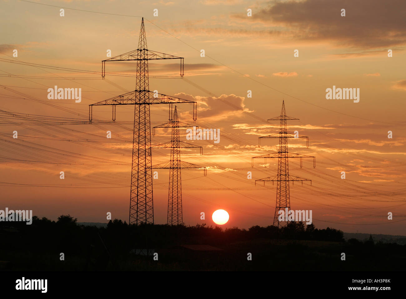 Electricity pylons at dusk in German country side Stock Photo - Alamy