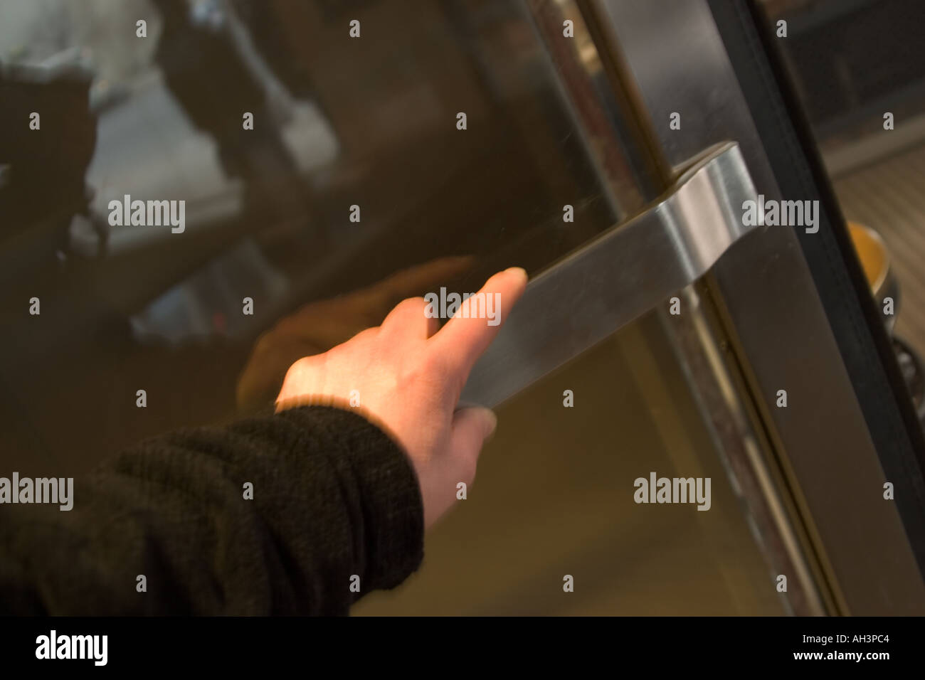 Hand pushing open a door in an office building Model Released Stock ...