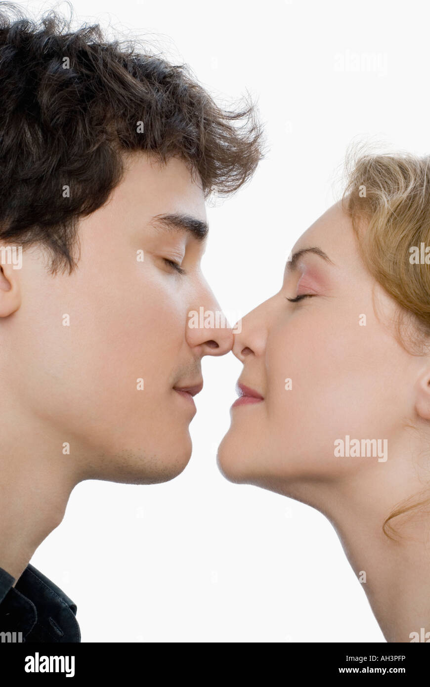 Close-up of a young couple rubbing noses Stock Photo - Alamy