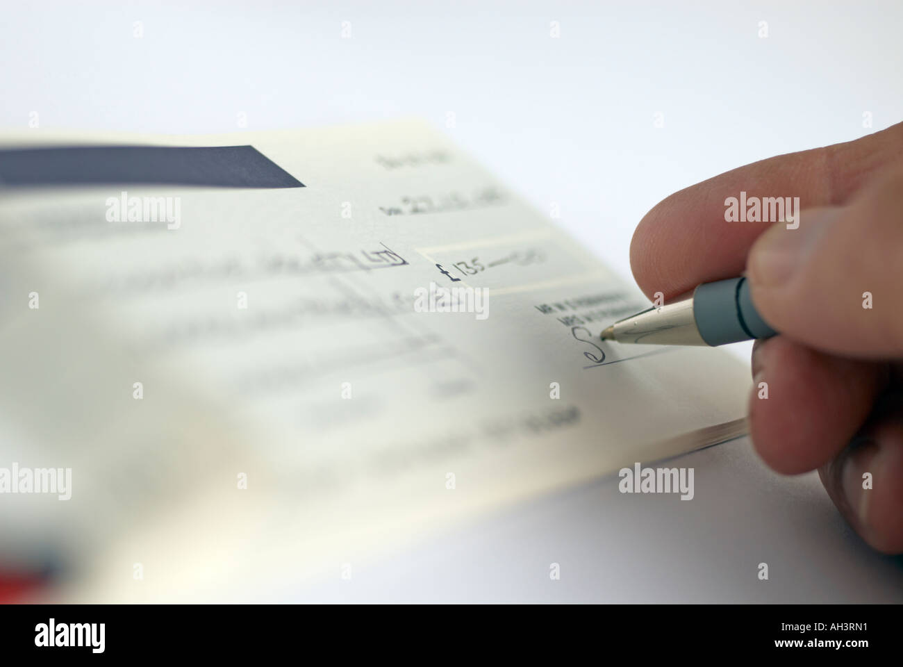 Signing a dated cheque Stock Photo - Alamy
