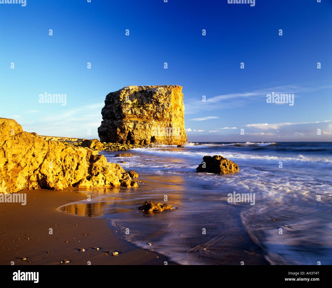 Marsden Rock on South Tyneside, Tyne and Wear at sunrise over a wet ...