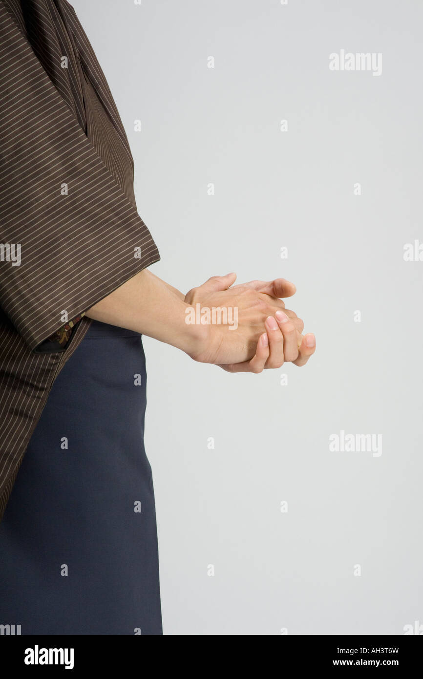 Man rubbing his hands together Stock Photo - Alamy