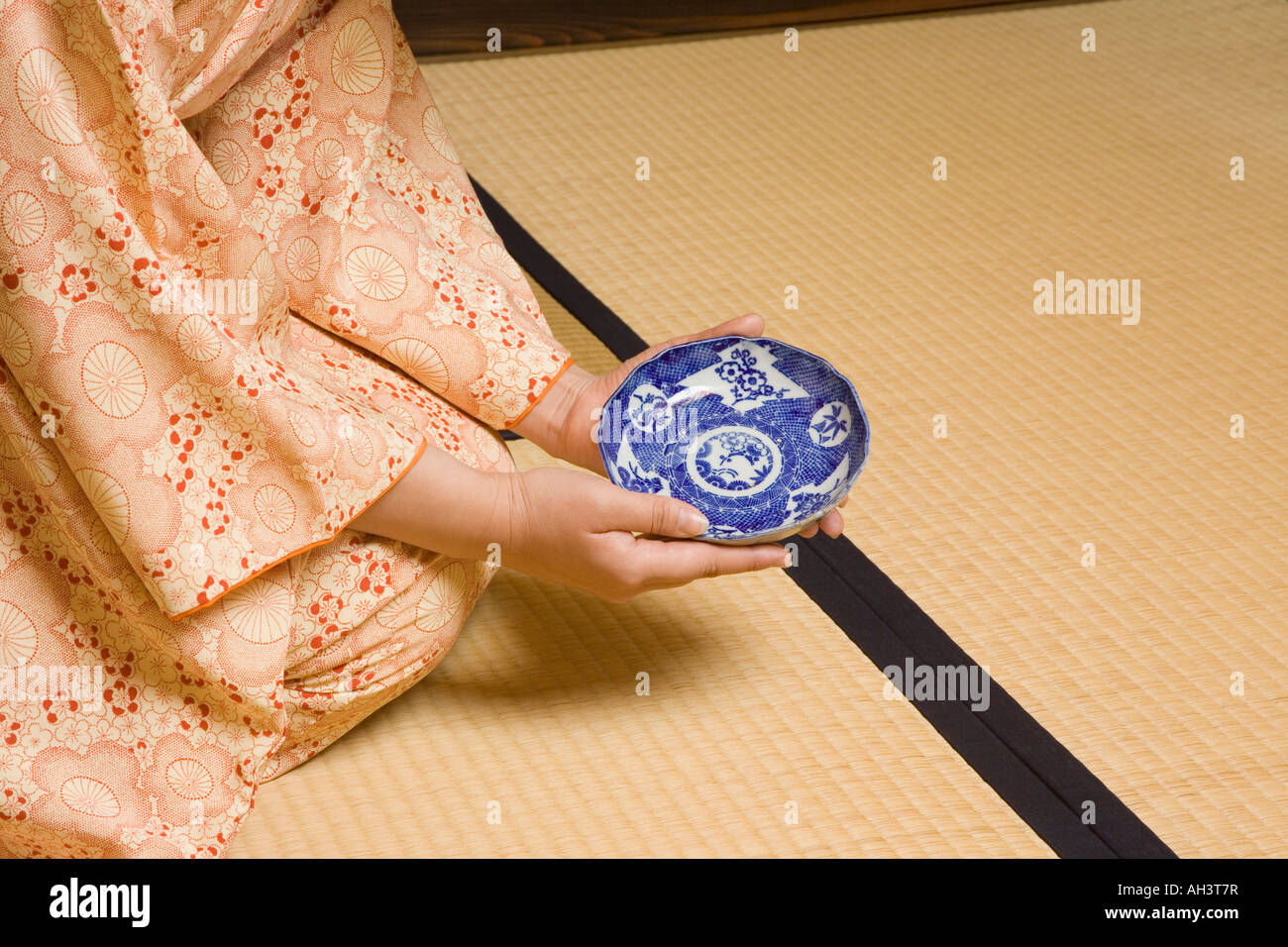 Woman examining plate Stock Photo - Alamy Woman examining plate Stock Photo - Alamy