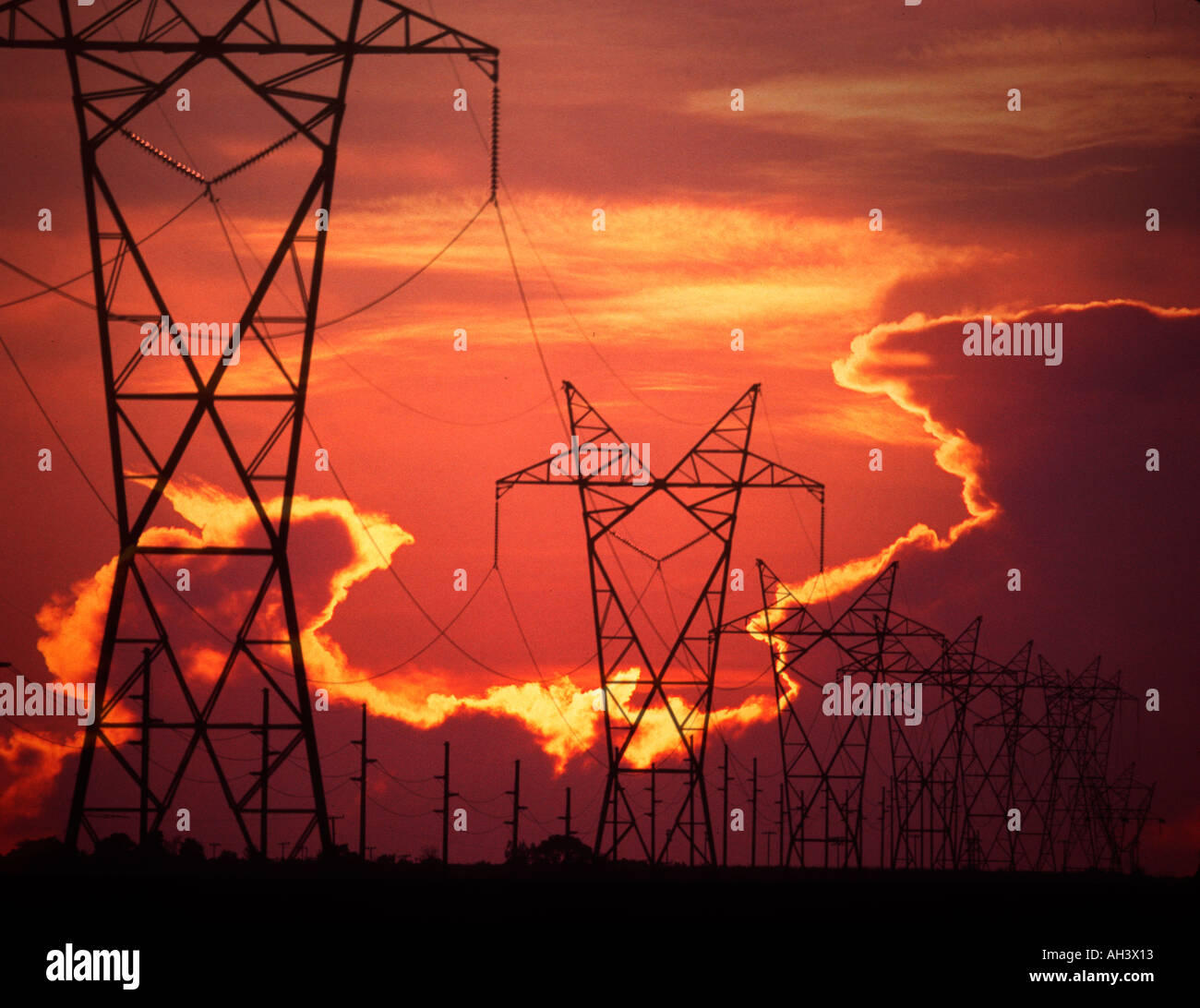 transmission towers at sunset Stock Photo - Alamy