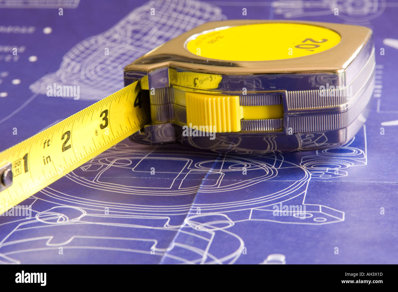 Tape measure on top of blueprints Stock Photo - Alamy