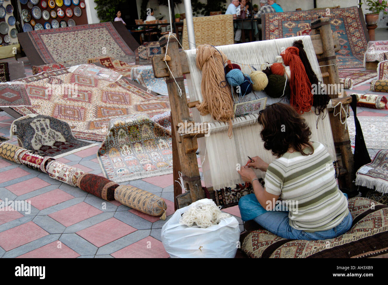 Woman making Turkish carpet by hand, Marmaris, Turkey Stock Photo - Alamy