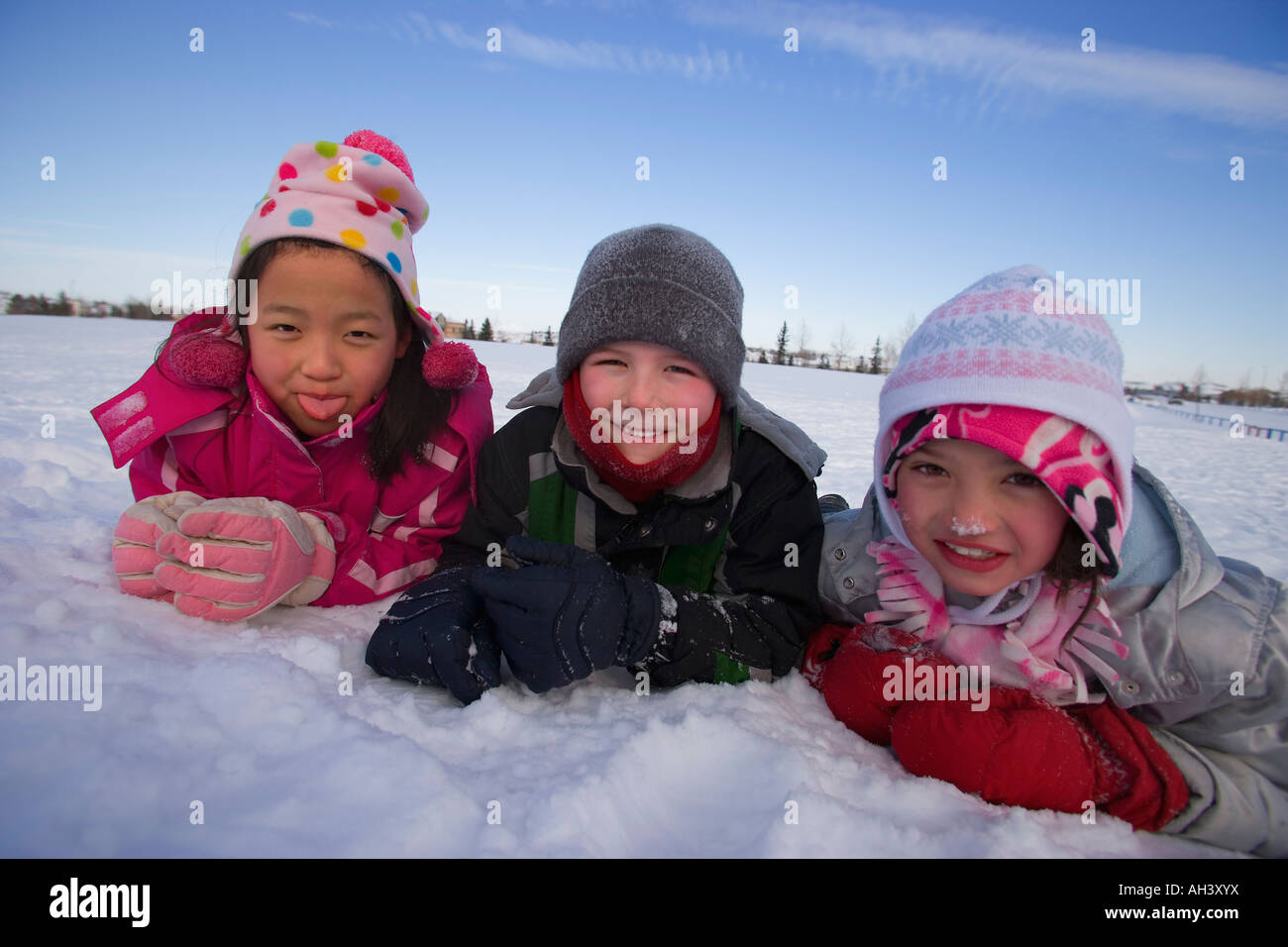 Children playing in the snow Stock Photo - Alamy